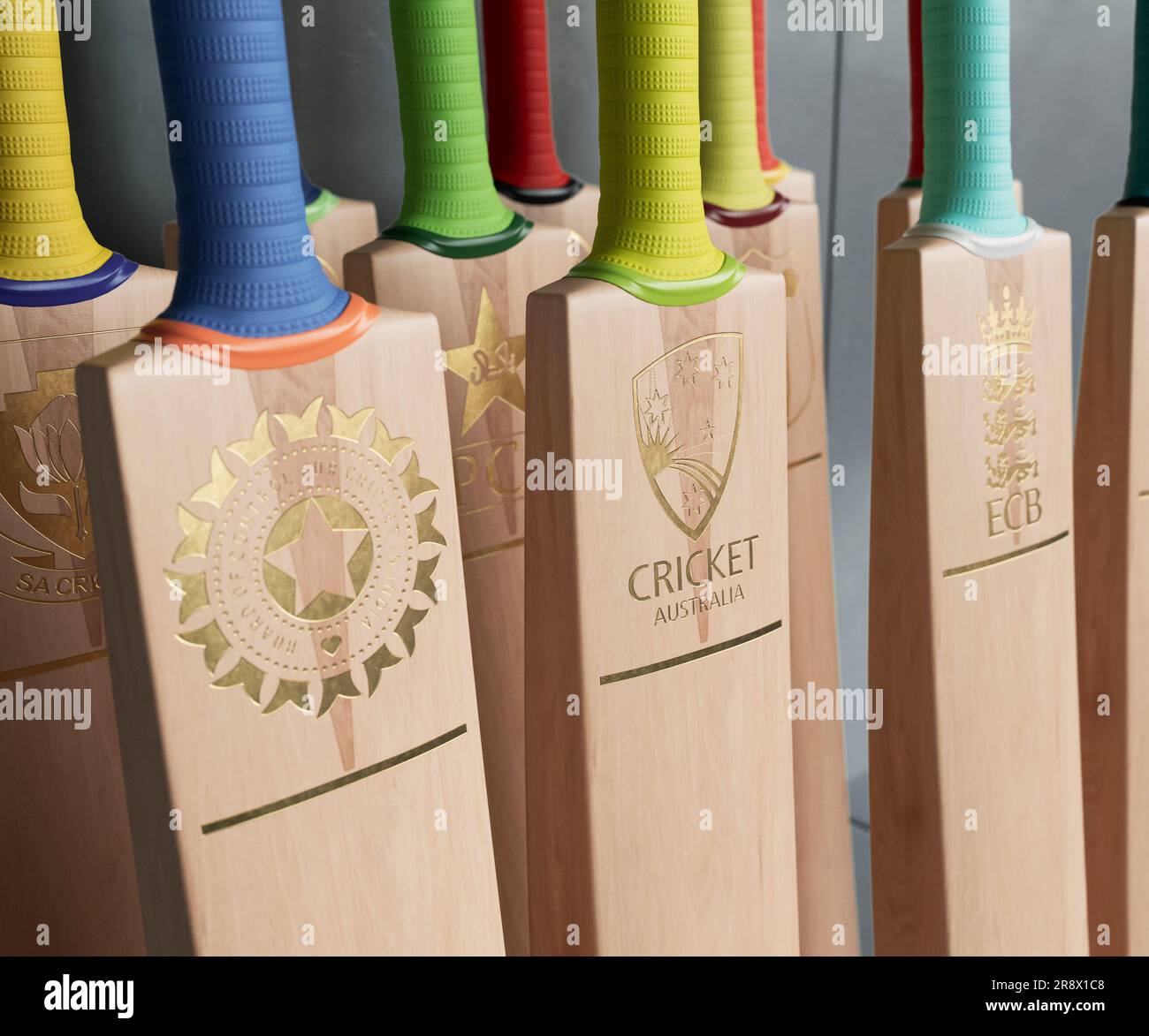 A collection of cricket bats imprinted with gold logos of the ICC ...