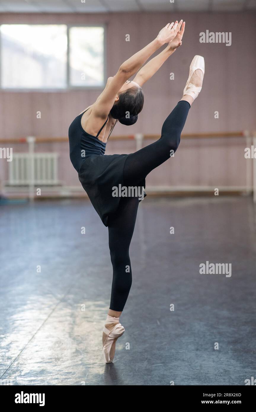 Asian woman dancing in ballet class doing bilman pose Stock Photo - Alamy