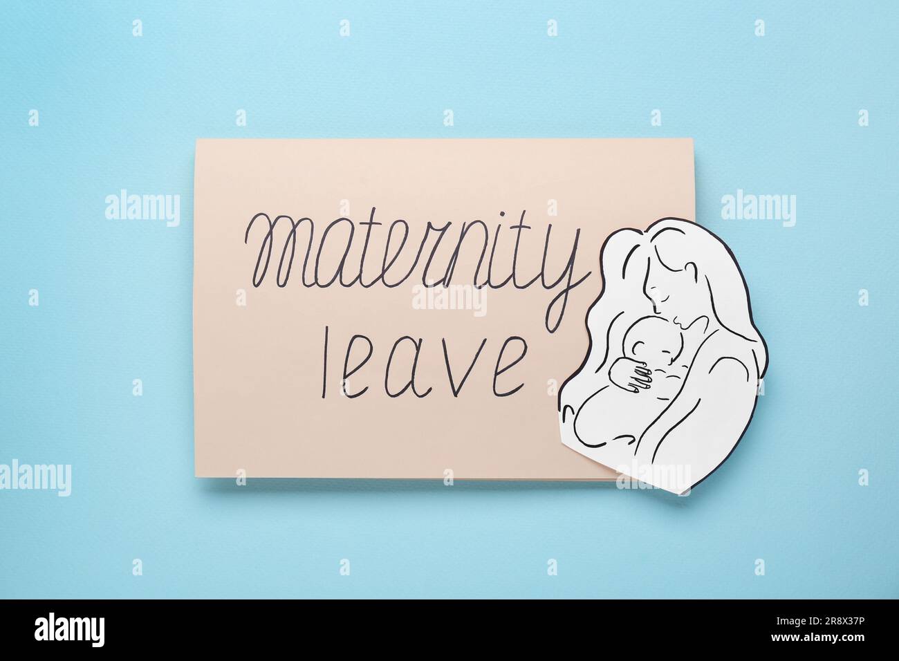 Card with phrase Maternity Leave, paper cutout of mother and child on ...