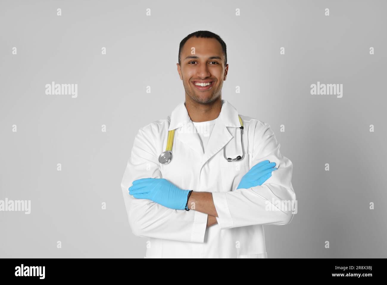 Doctor or medical assistant (male nurse) in uniform with stethoscope on ...
