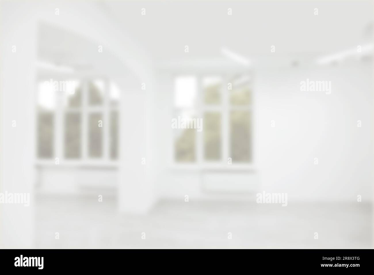 Empty room with white wall and windows, blurred view Stock Photo - Alamy