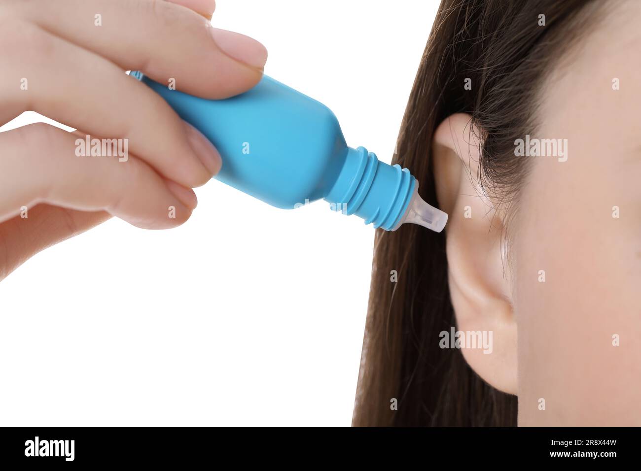 Woman using ear drops on white background, closeup Stock Photo - Alamy
