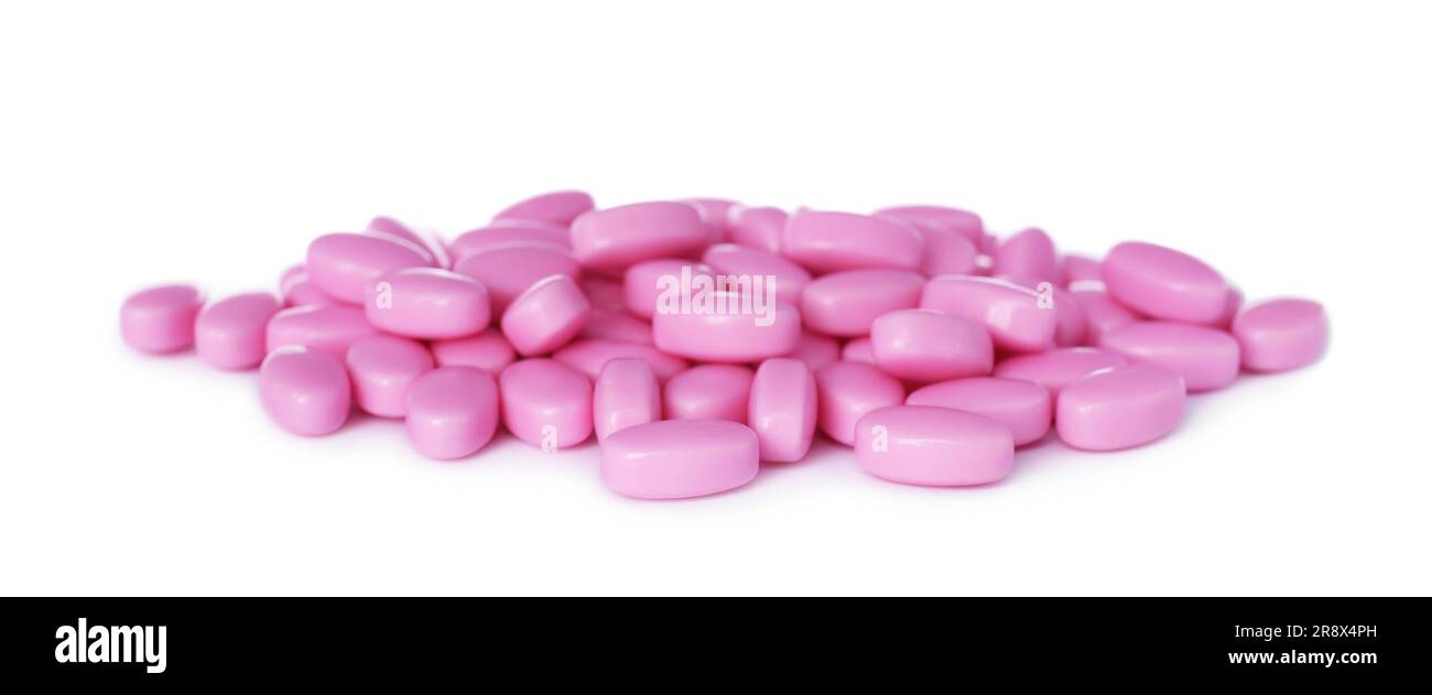 Tasty pink dragee candies on white background Stock Photo - Alamy