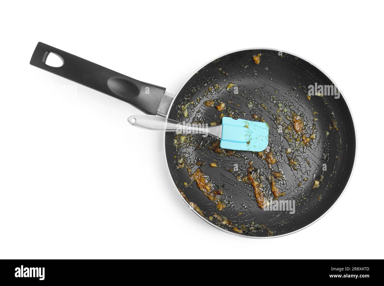 Dirty frying pan and spatula on white background, top view Stock Photo ...