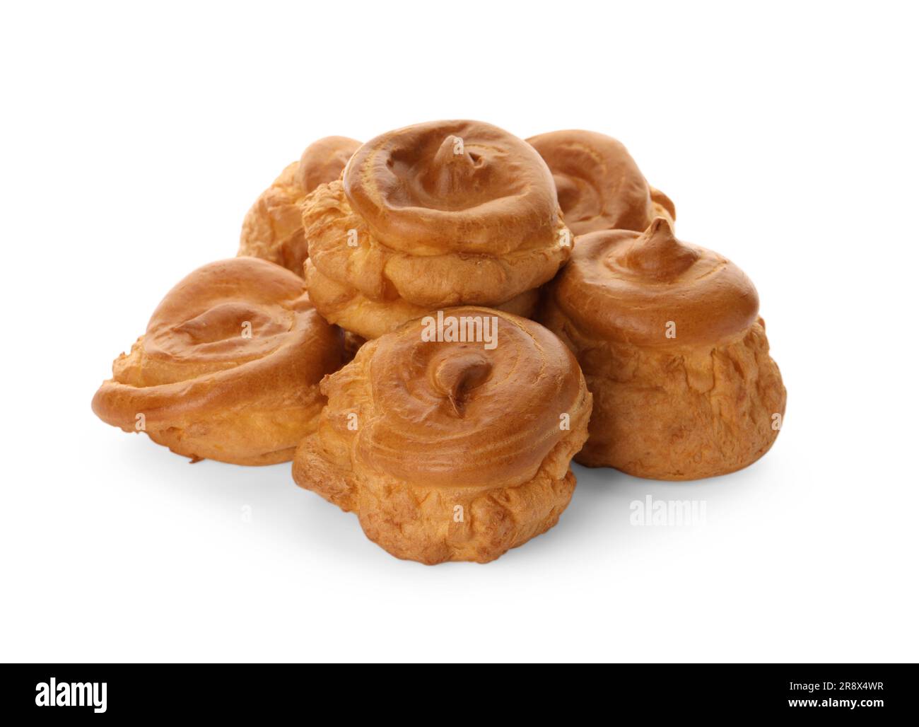 Pile of delicious profiteroles on white background Stock Photo - Alamy