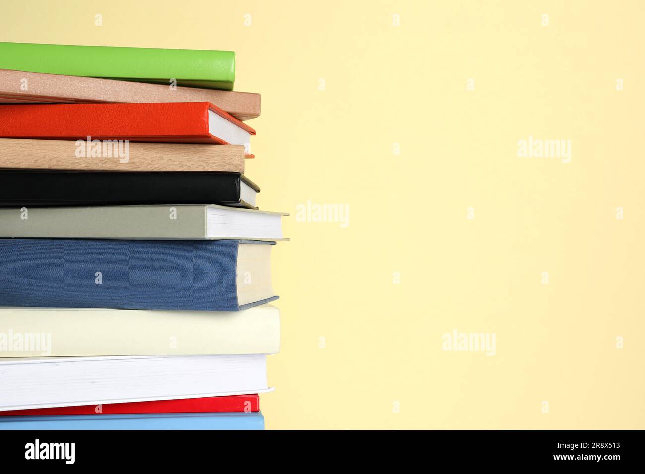 Stack of different books on beige background, space for text Stock ...