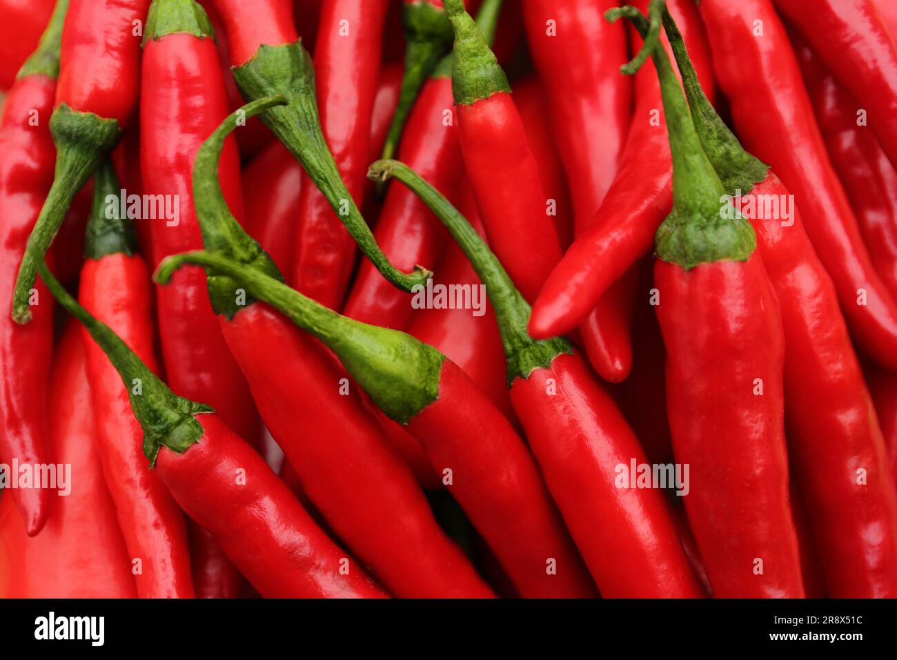 Red hot chili peppers as background, top view Stock Photo - Alamy