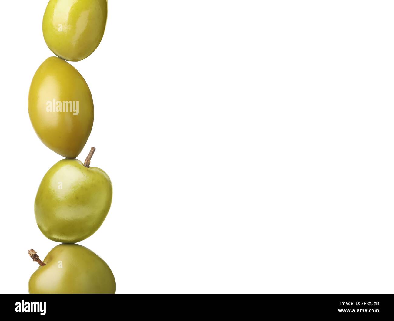Stack of whole green olives on white background Stock Photo - Alamy