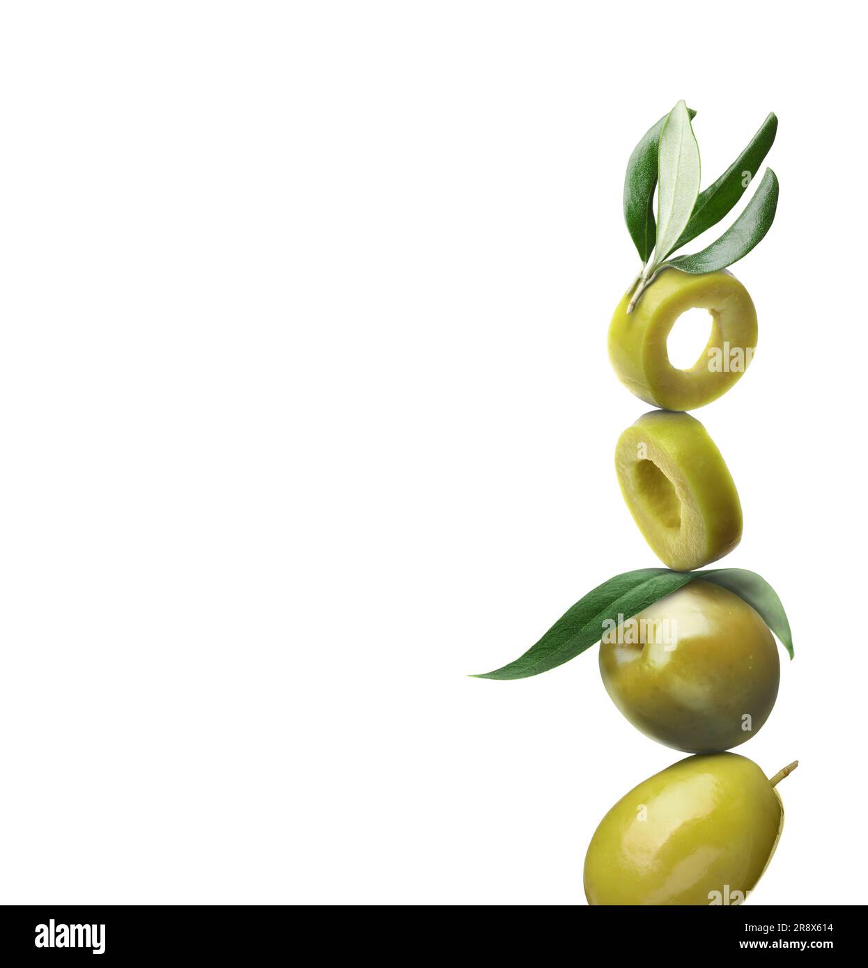 Cut and whole green olives with leaves on white background Stock Photo ...