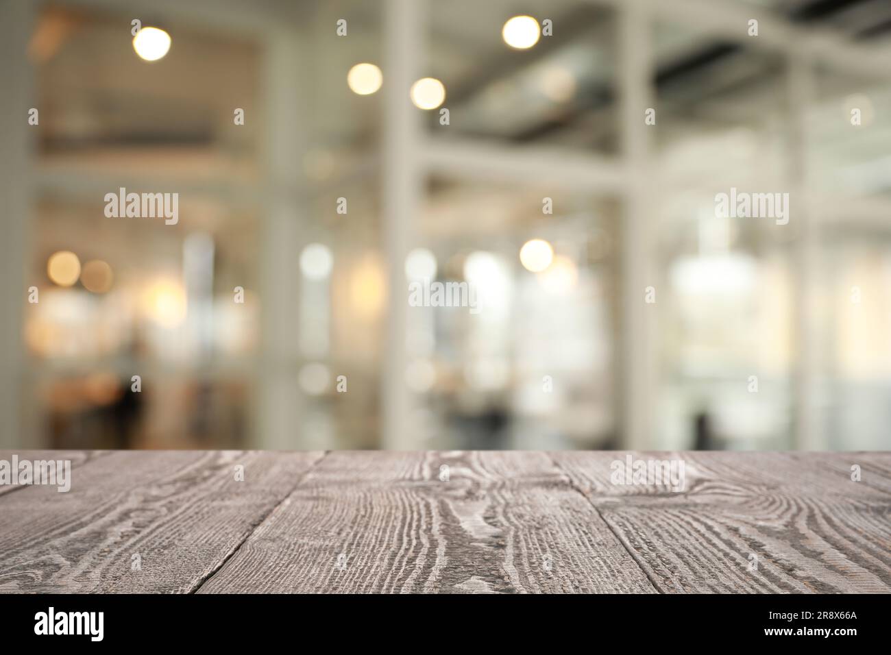 Empty wooden table in hall. Space for design Stock Photo - Alamy