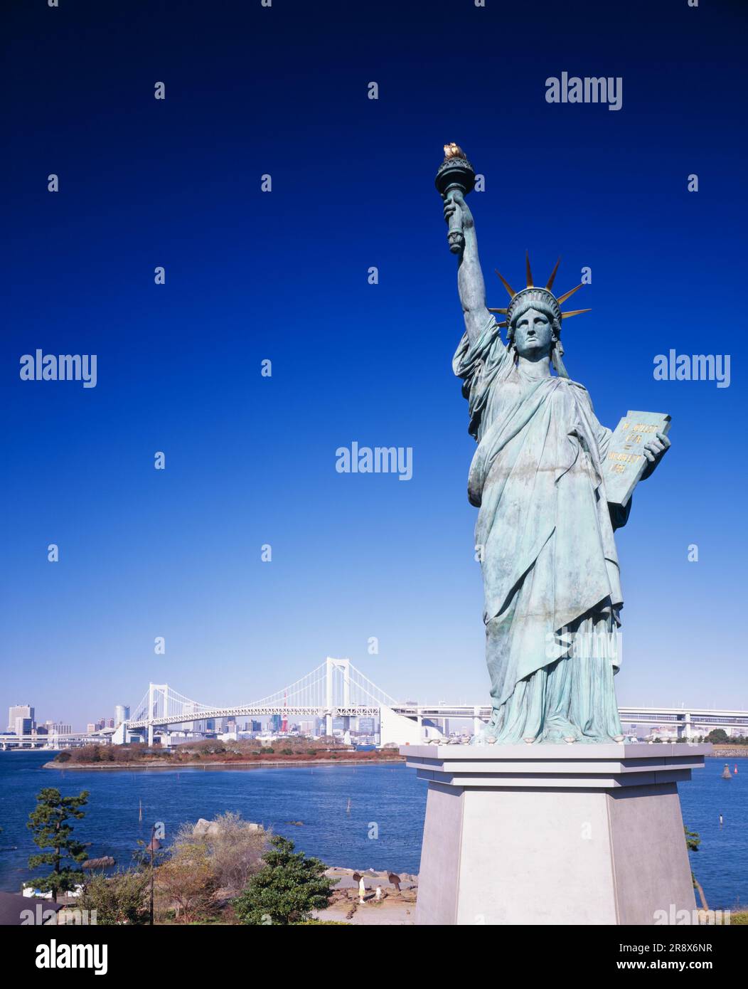 The statue of liberty and Rainbow Bridge Stock Photo - Alamy