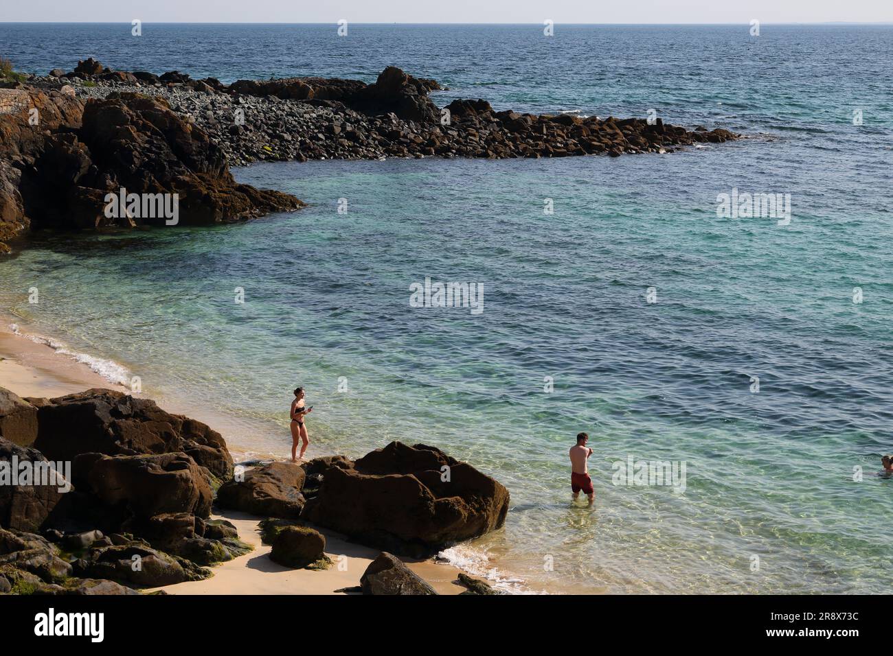Swimmers enjoy the sandy beach and sea at St Ives, Cornwall, UK Stock ...