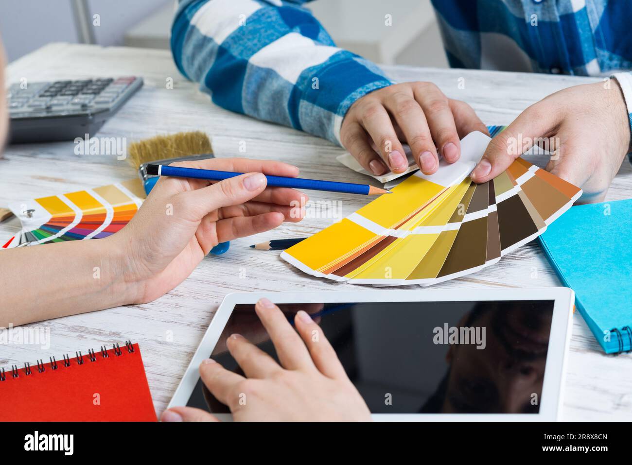 Interior designer choosing colors from swatches Stock Photo - Alamy