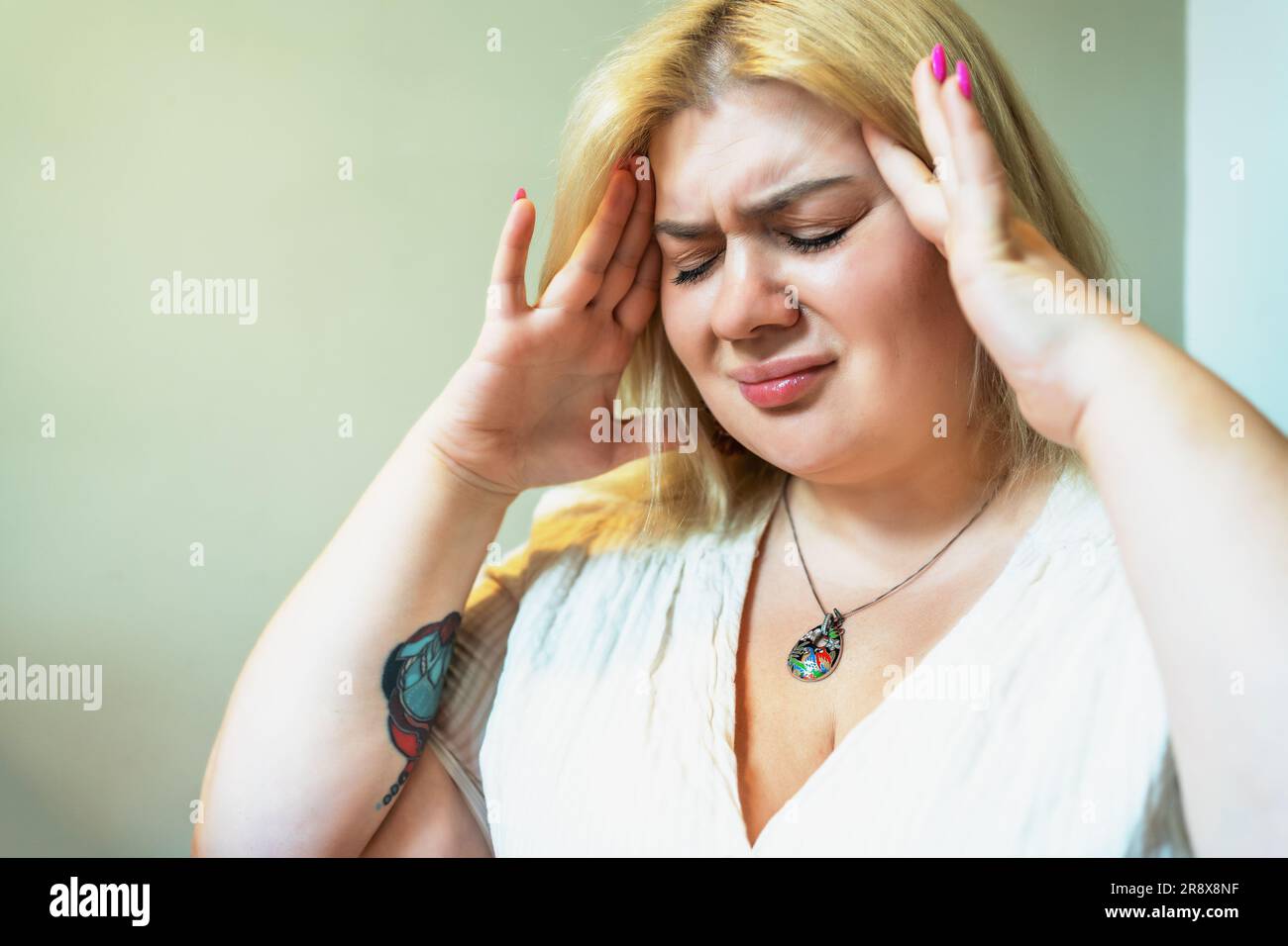 Plus size worried blonde woman hi-res stock photography and images - Alamy