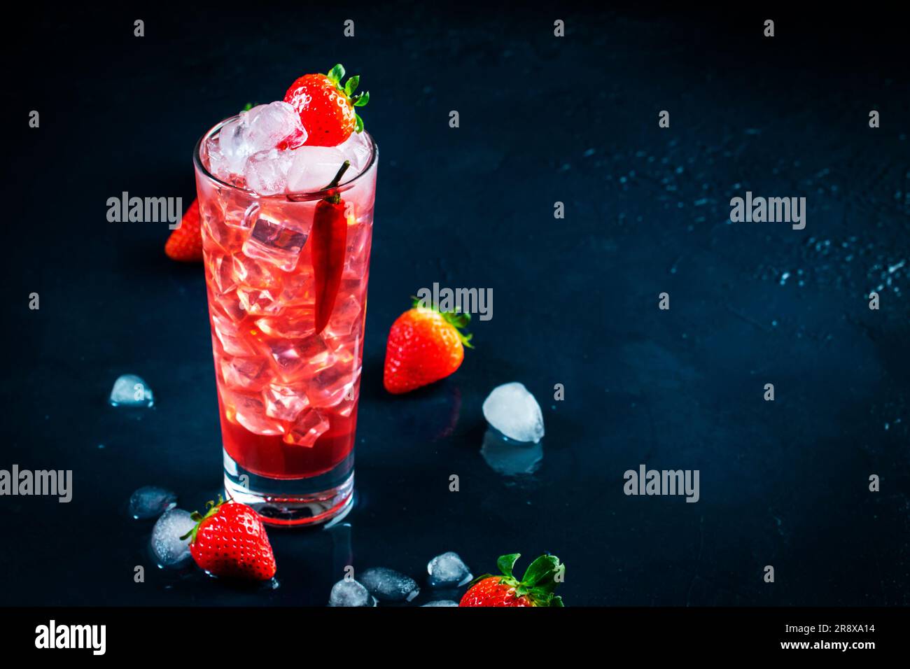 Red alcoholic cocktail drink with vodka, grapefruit juice, strawberries ...