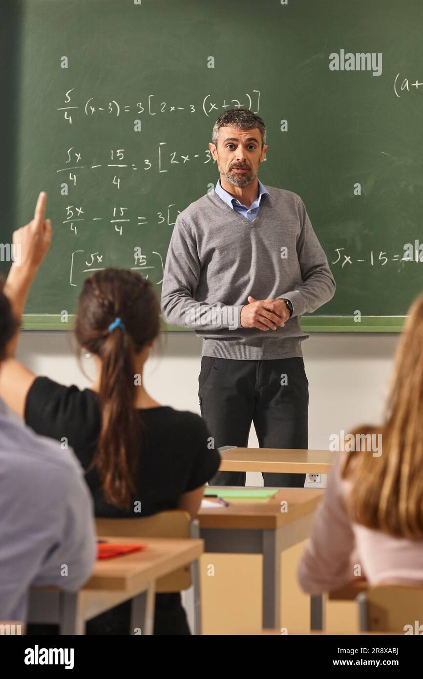 Math teacher giving lessons. Classroom with students. School education ...