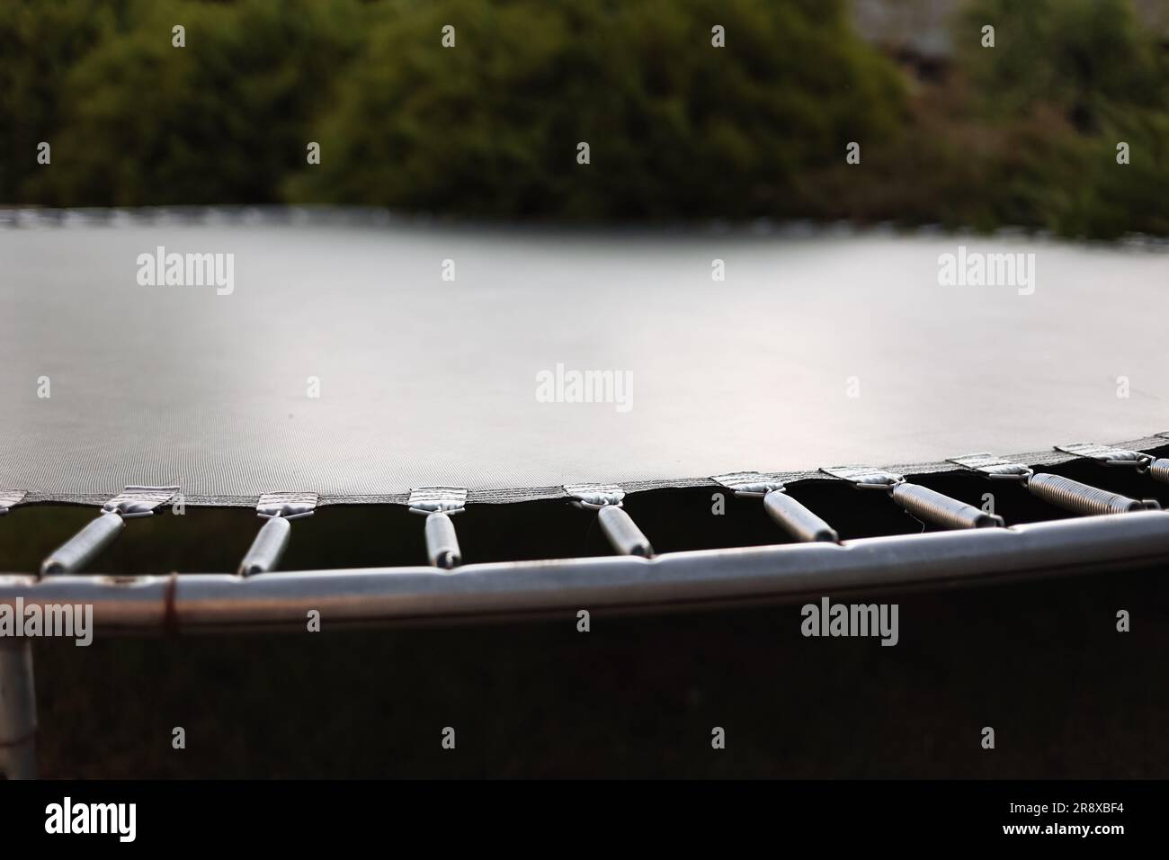 Recreation area. Modern opened trampoline without barrier, metal ...