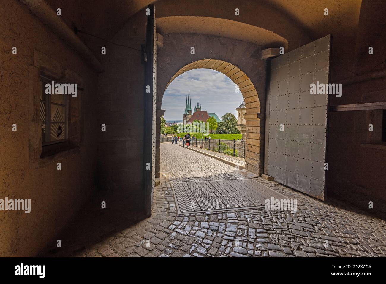 View through a historical archway of a Middle Ages castle in daylight ...