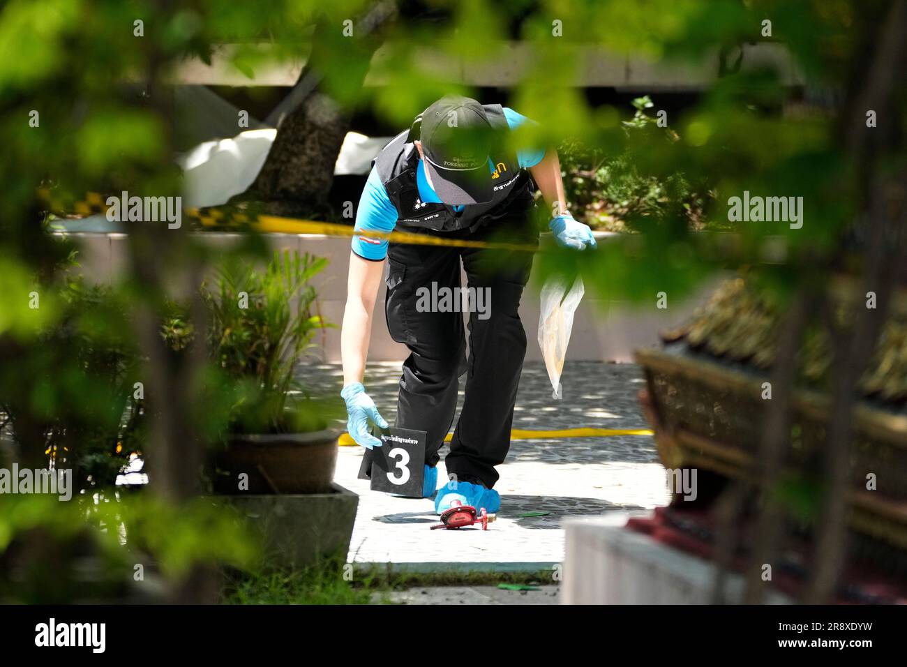 A forensic expert investigate at an explosion site in a school in ...