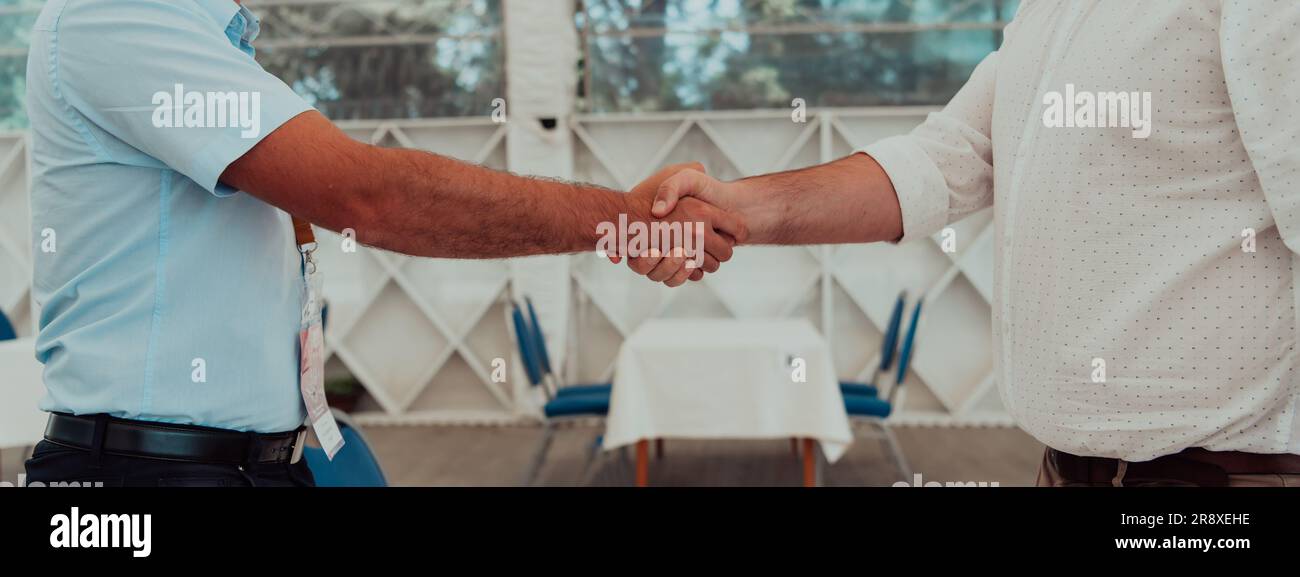 Close up a handshake, businessman together creates a mutually ...
