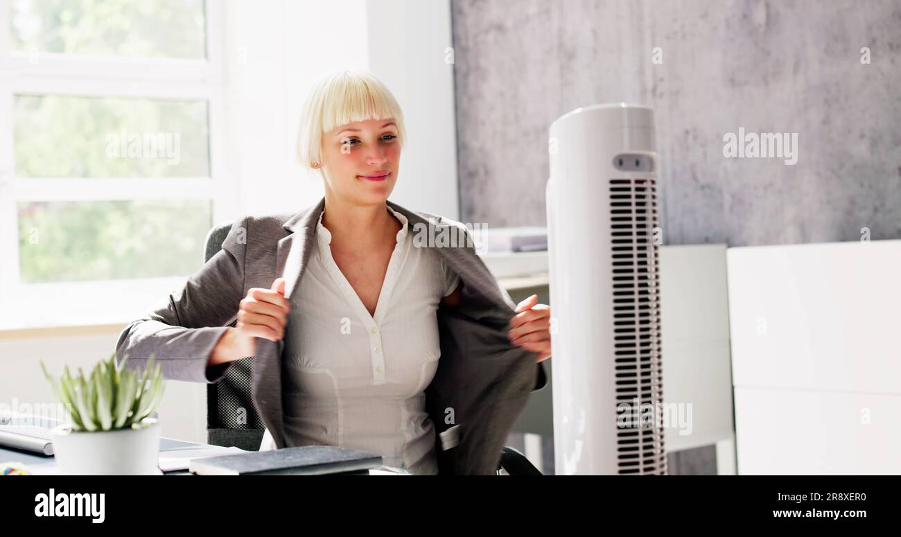 Electric Ventilator Fan In Hot Office Blowing Cool Breeze Stock Photo ...