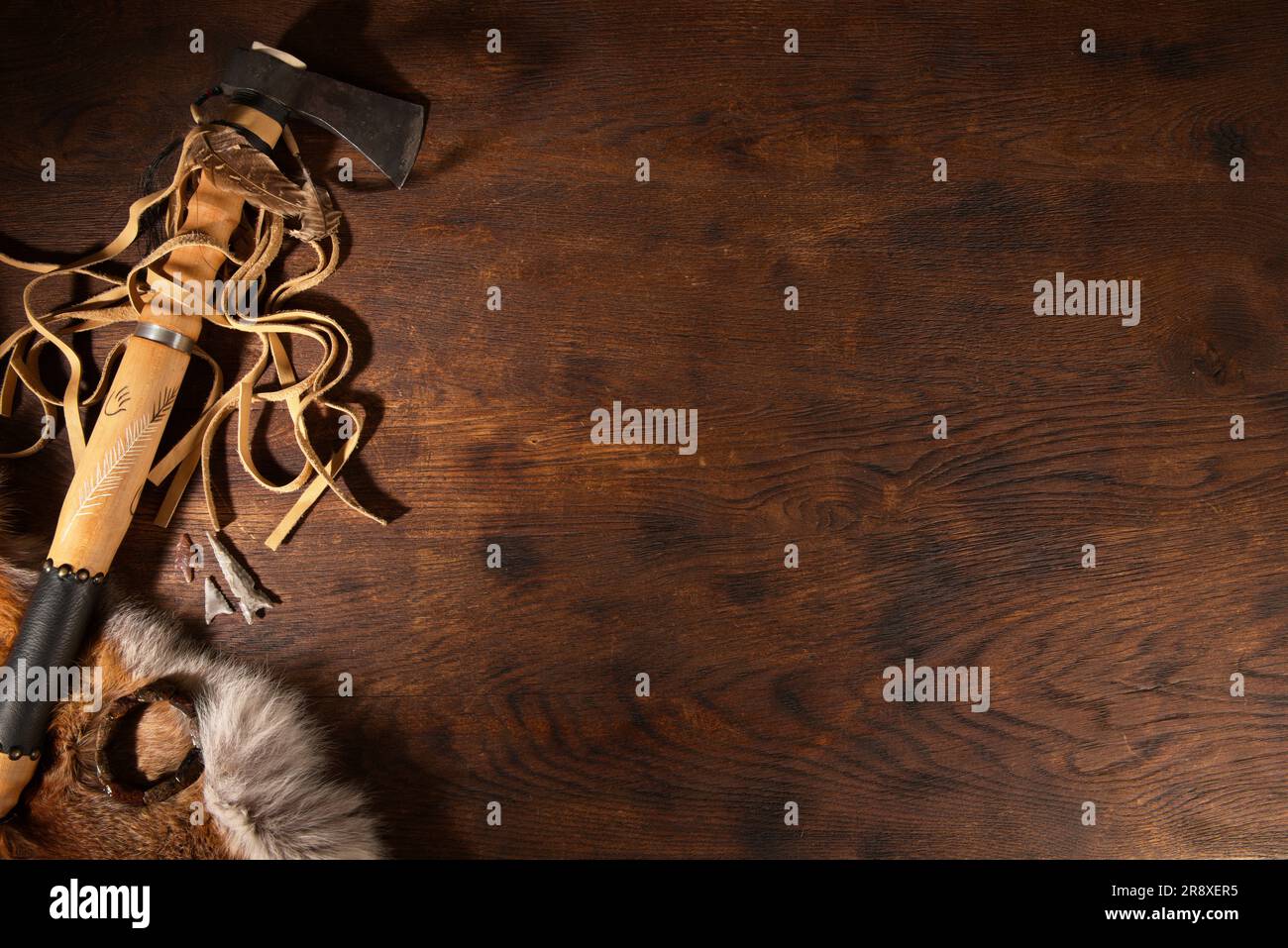 Tomahawk with Fox Coat on wooden Table - Background Stock Photo - Alamy