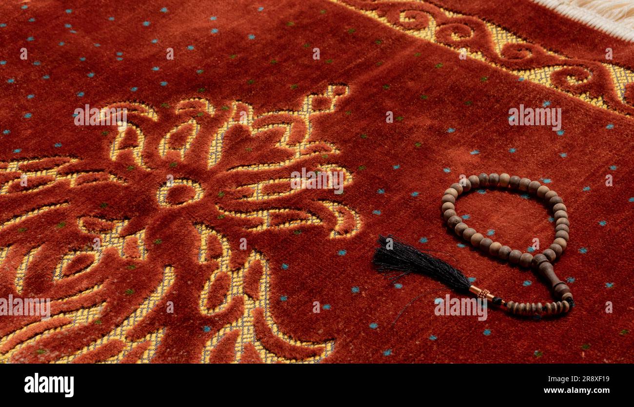 Muslim things called tasbeh and sajjada for prayer. Photo after some ...