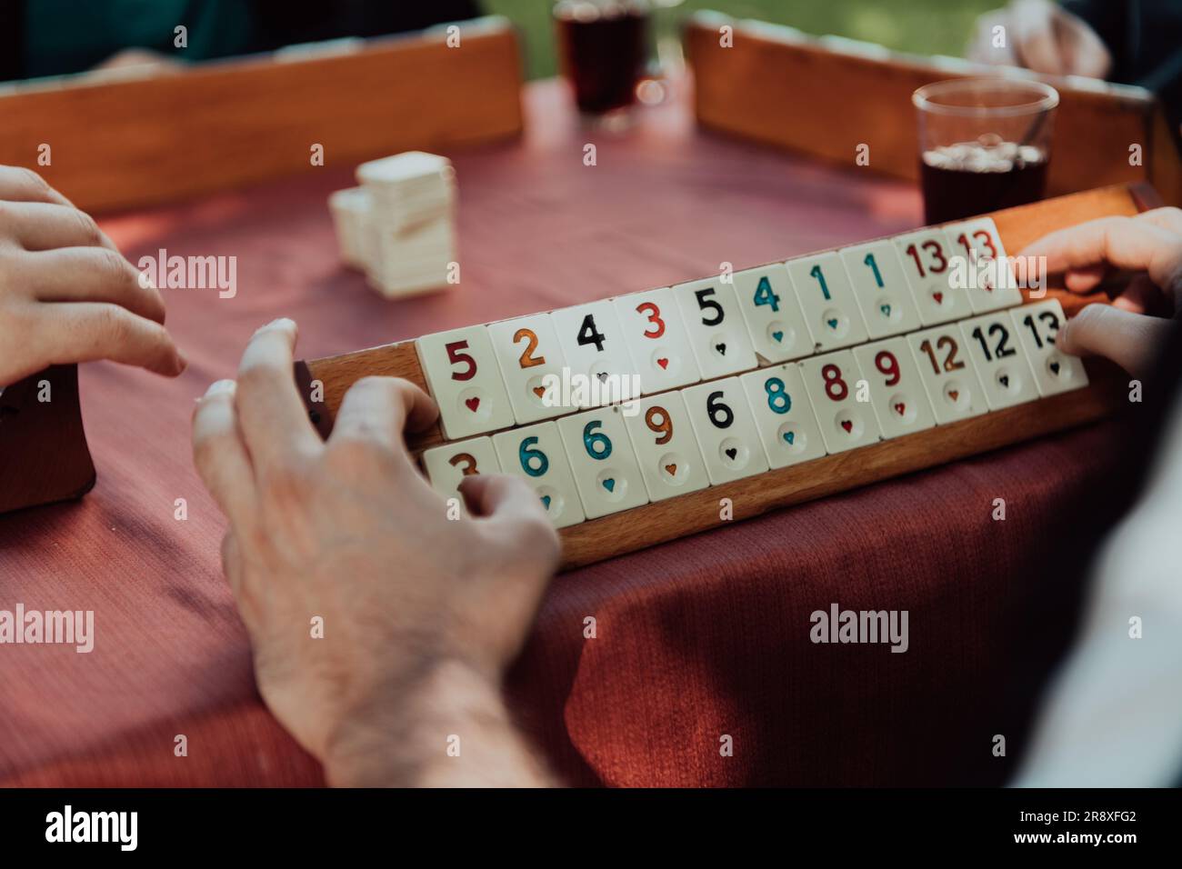 A group of men drink traditional Turkish tea and play a Turkish game ...