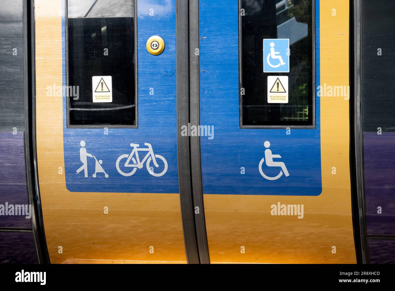 Pushchair, bicycle and wheelchair symbols on a West Midlands Railway ...