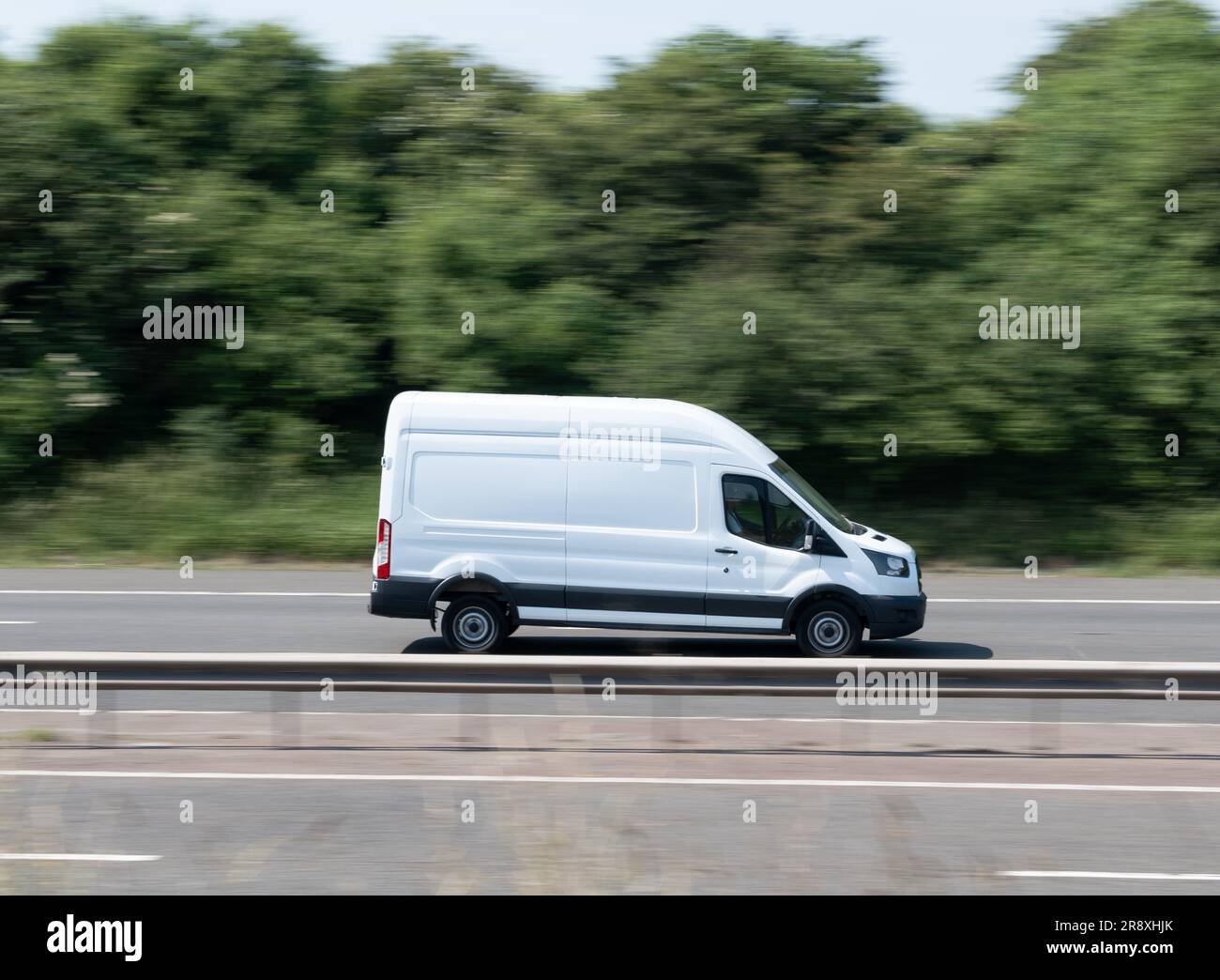 A white van at speed on the M40 motorway, Warwickshire, UK Stock Photo ...