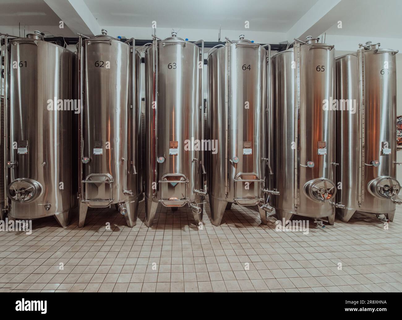 Modern wine distillery and brewery with brew kettles pipes and ...
