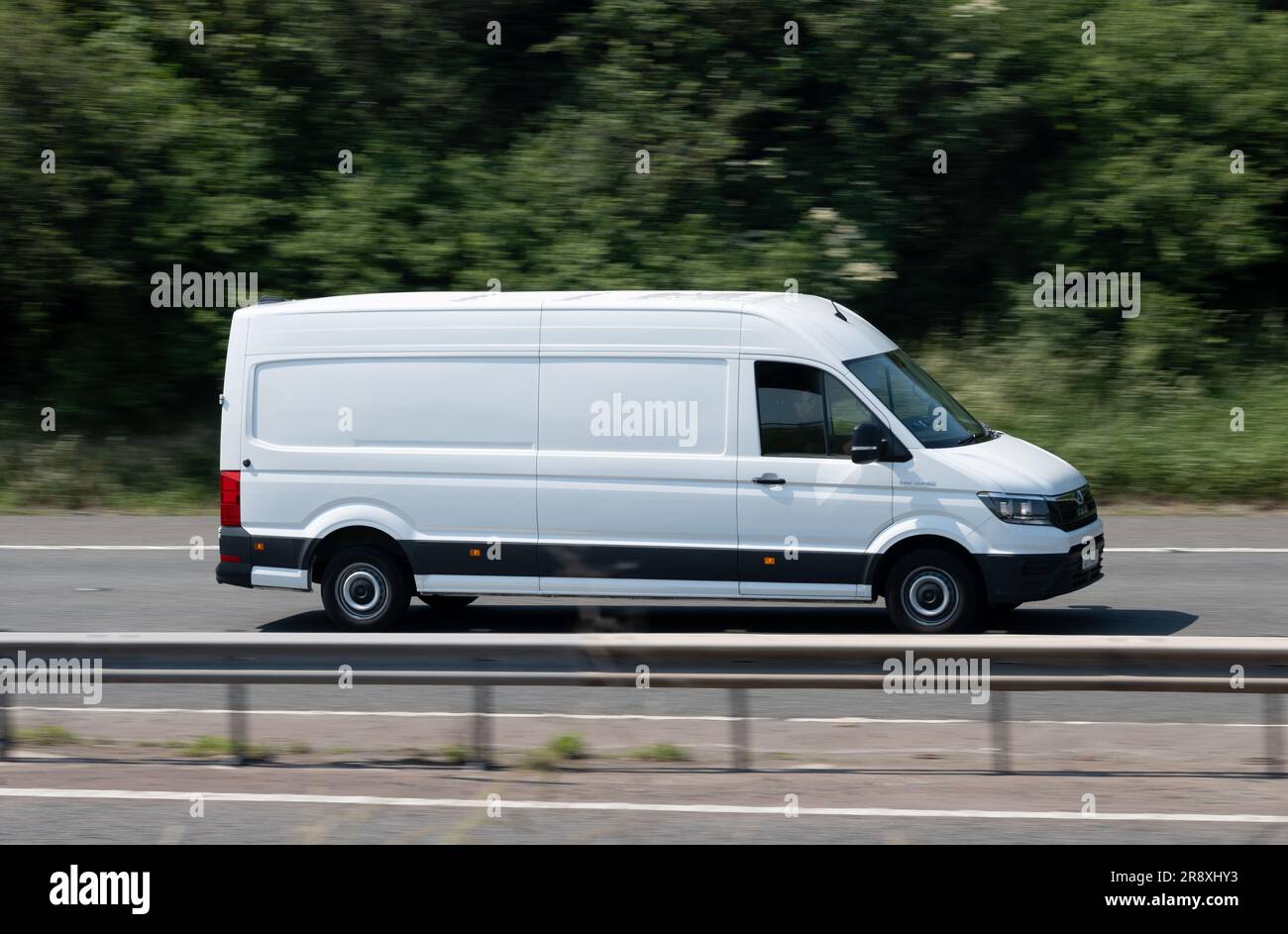 A white van at speed on the M40 motorway, Warwickshire, UK Stock Photo ...