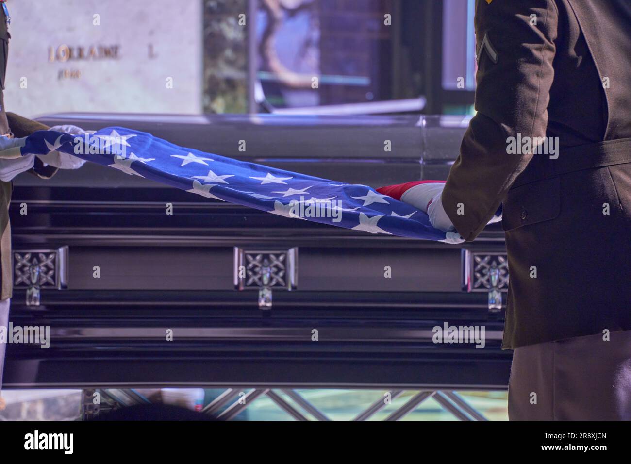 American Army Soldiers folding an American flag from the coffin Stock ...