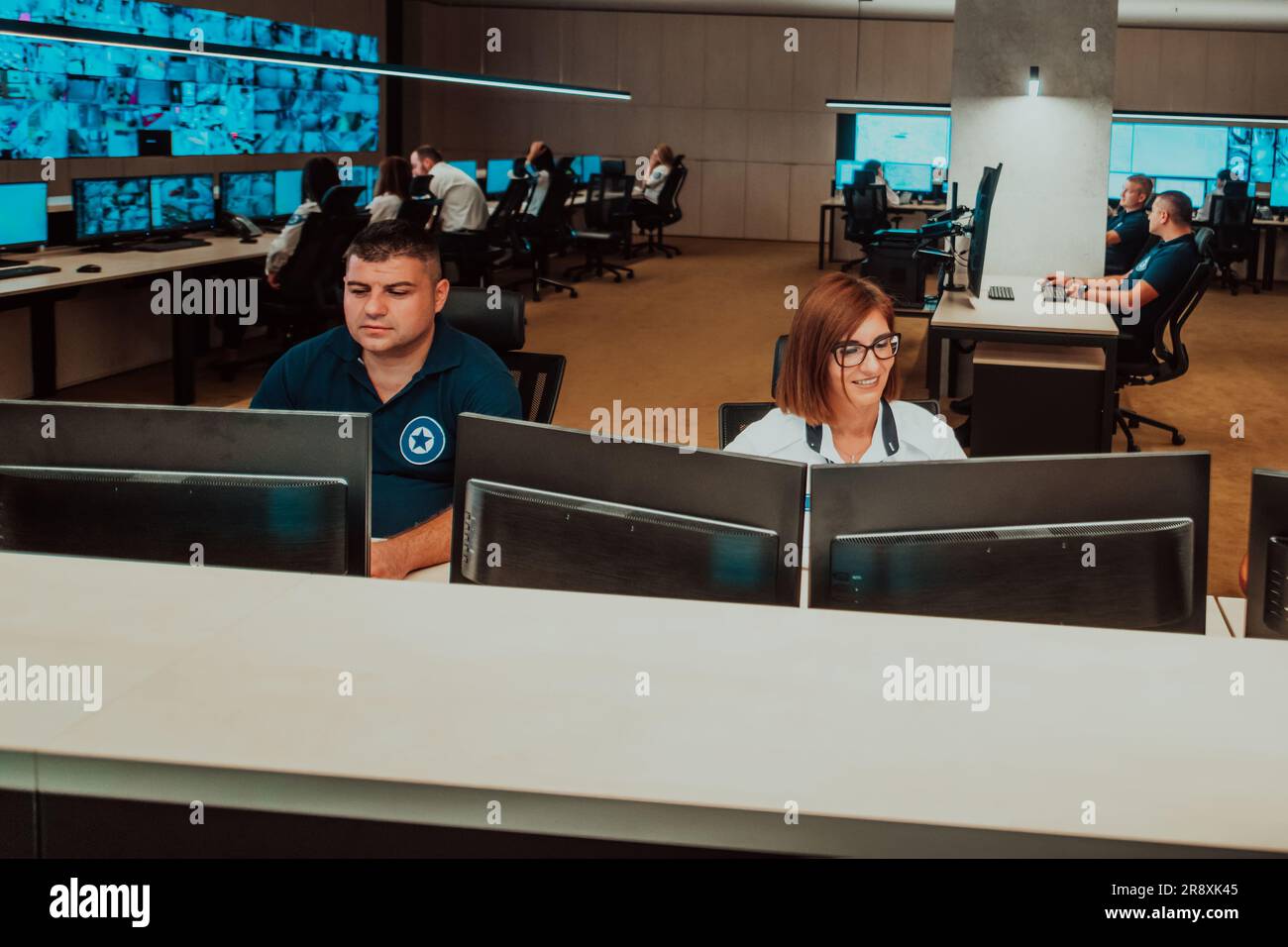 Group of Security data center operators working in a CCTV monitoring ...