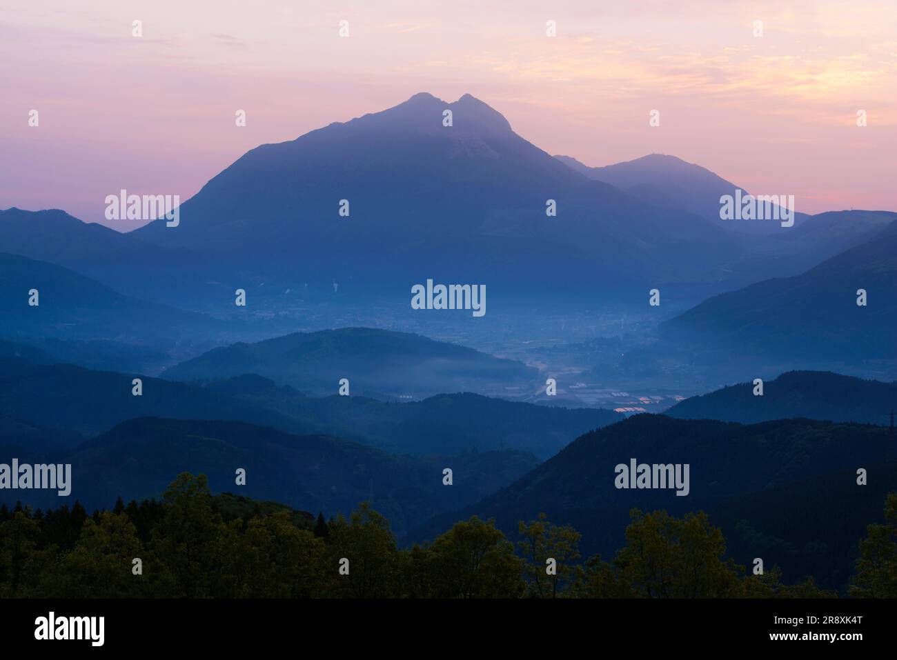 Yufuincho and Mount yufu in a morning mist Stock Photo - Alamy