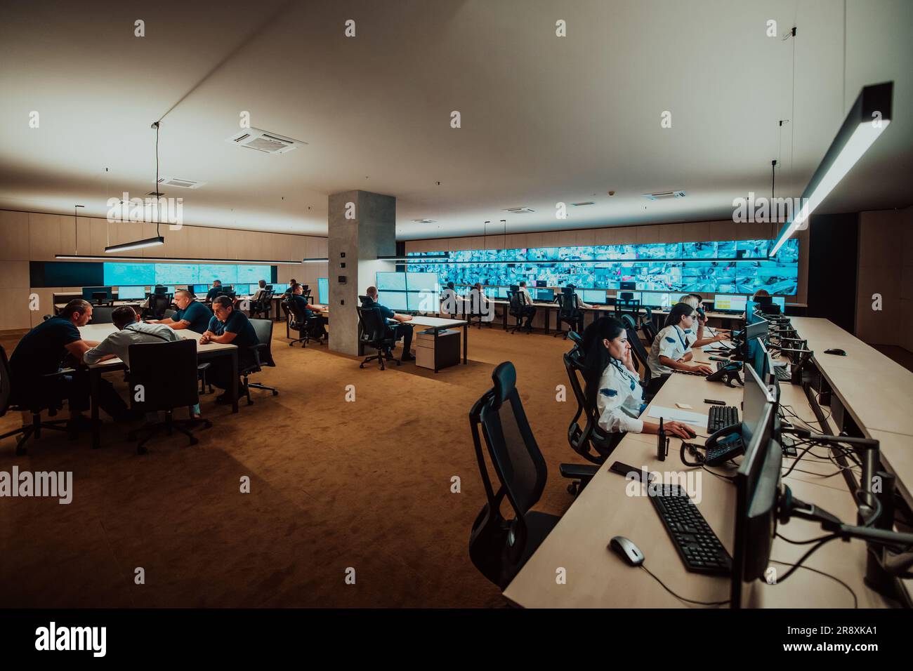 Group of Security data center operators working in a CCTV monitoring ...