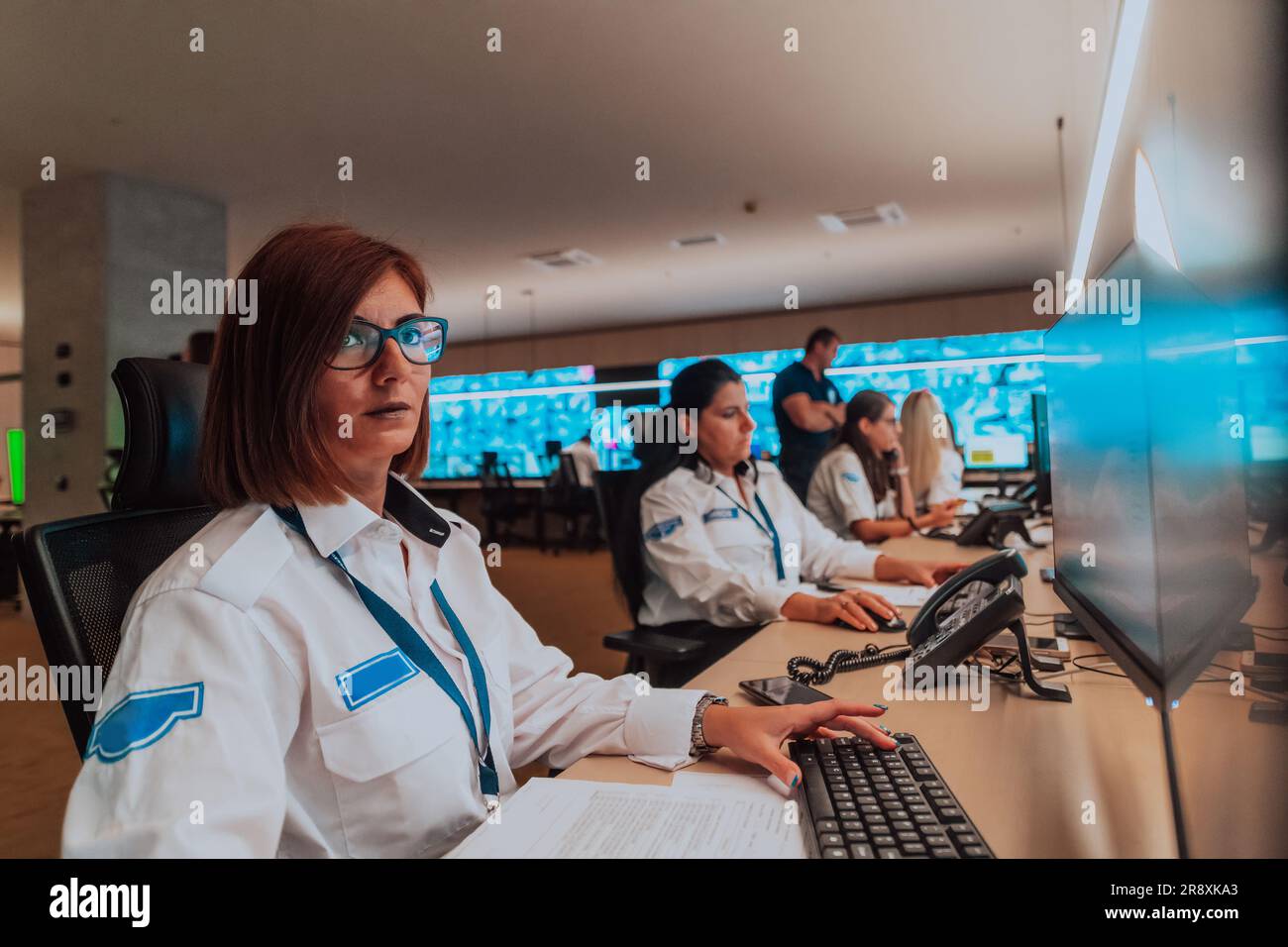 Group of Security data center operators working in a CCTV monitoring ...