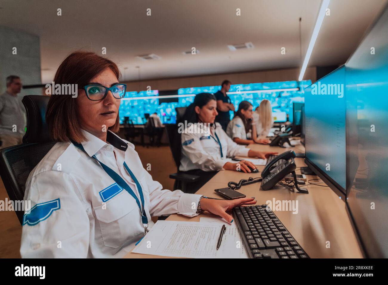 Group of Security data center operators working in a CCTV monitoring ...