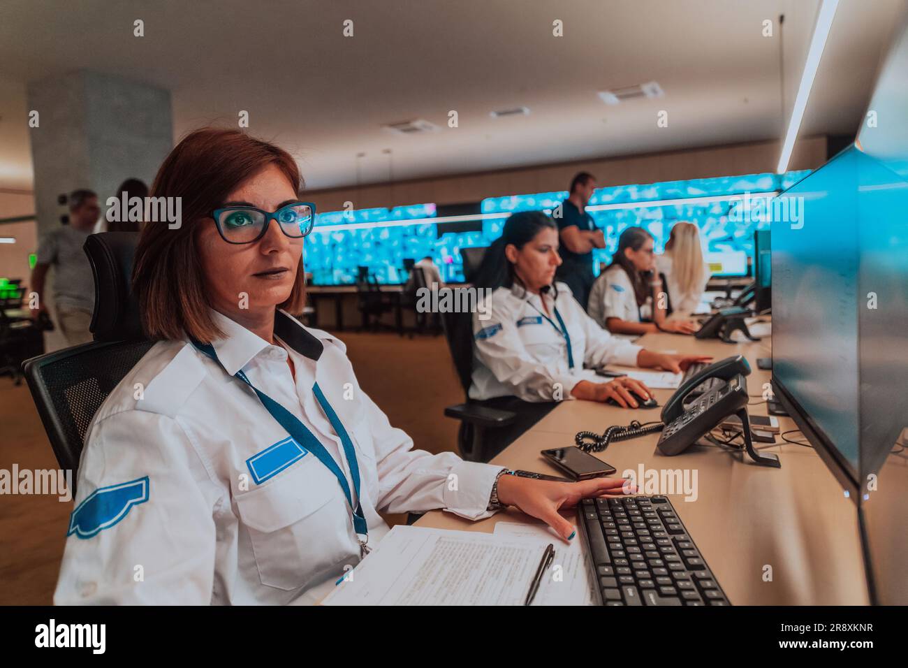 Group of Security data center operators working in a CCTV monitoring ...