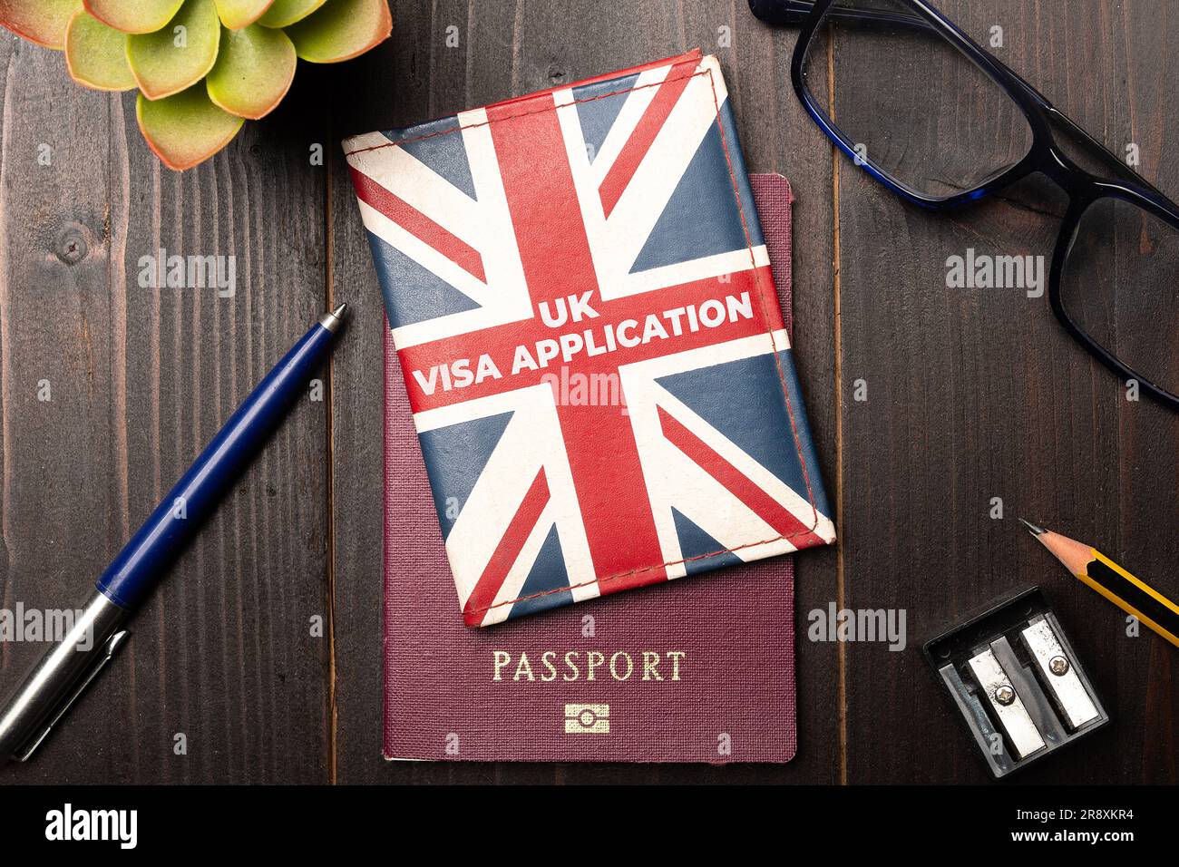 Uk visa application concept: a union jack colored wallet over a generic ...