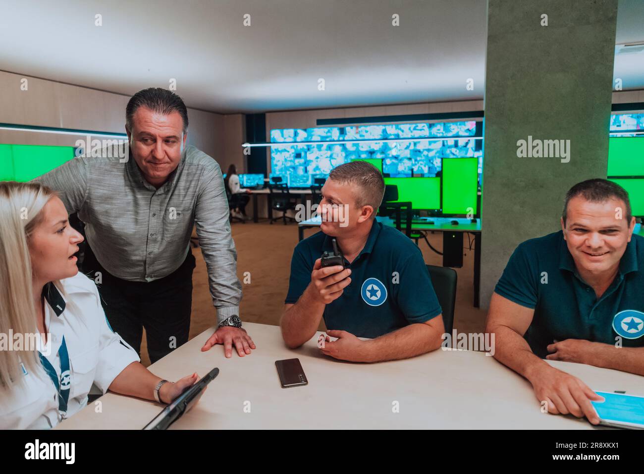 Group of security guards sitting and having briefing In the system ...