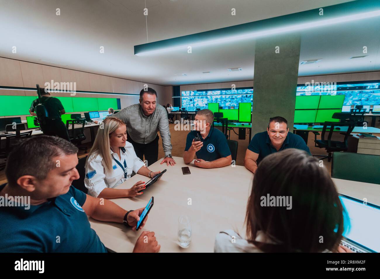 Group of security guards sitting and having briefing In the system ...