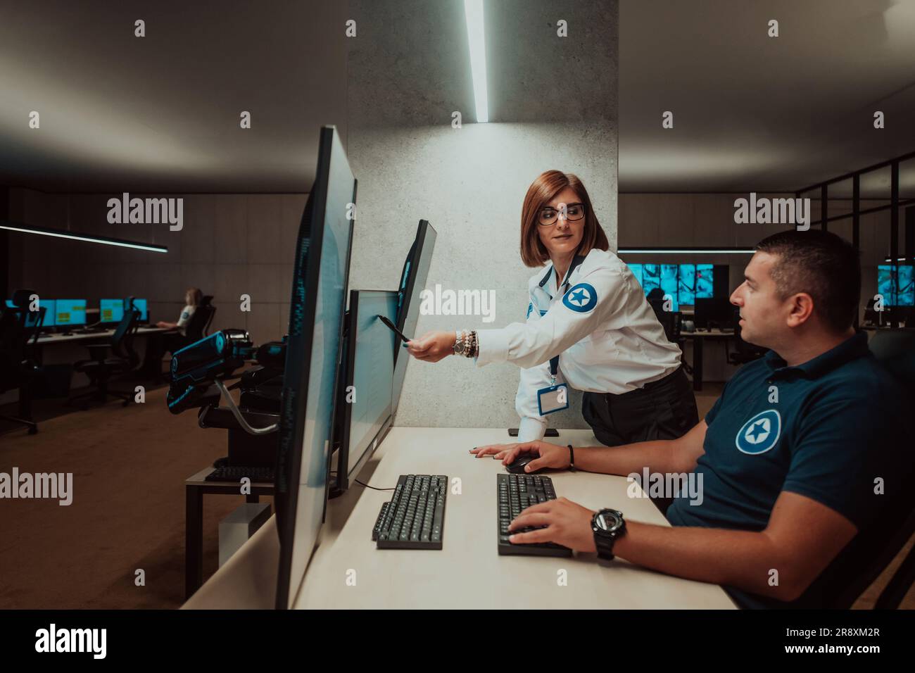 Group of Security data center operators working in a CCTV monitoring ...