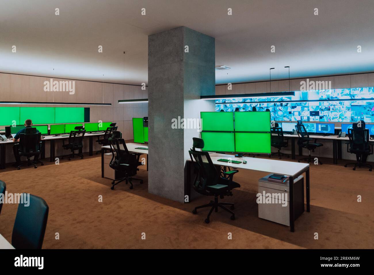 Group of Security data center operators working in a CCTV monitoring ...