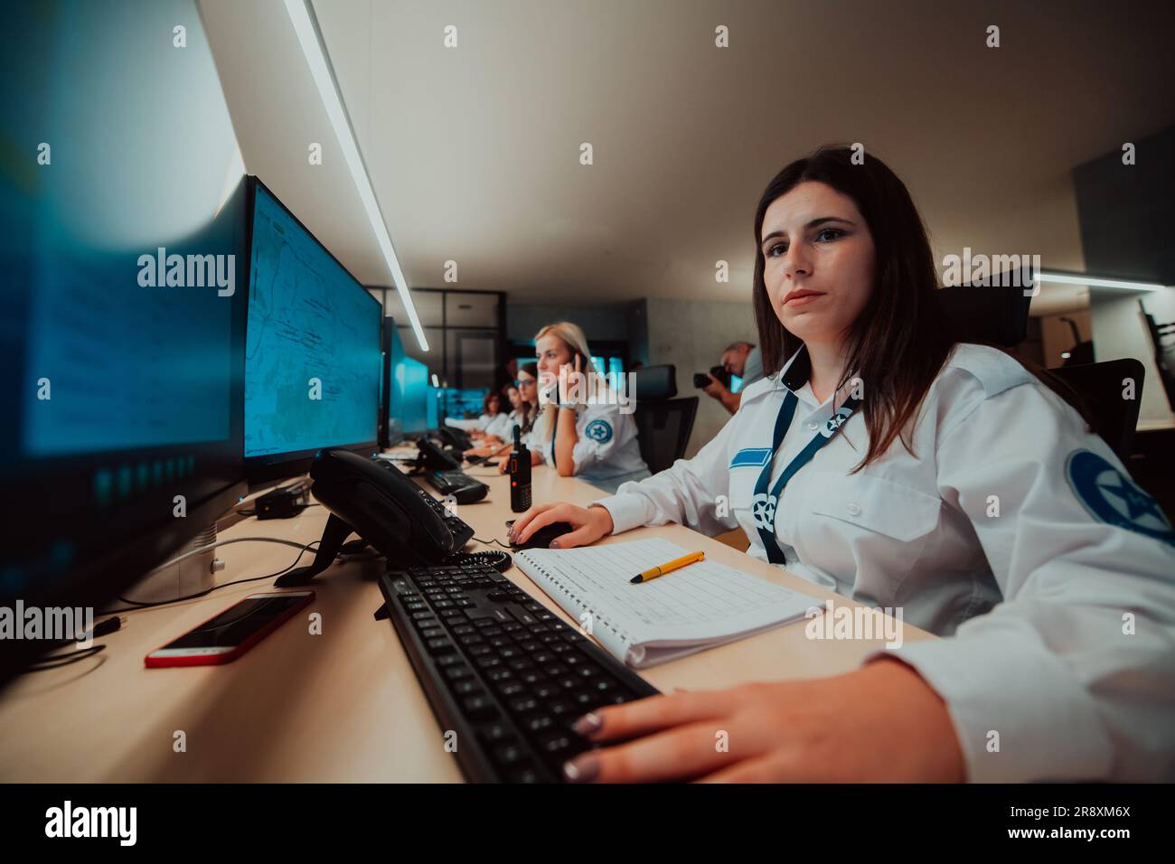 Group of Security data center operators working in a CCTV monitoring ...