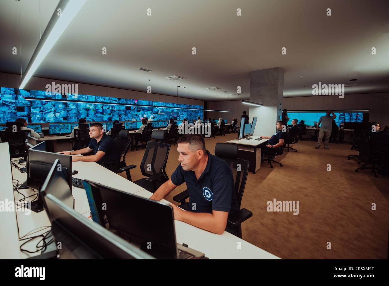 Group of Security data center operators working in a CCTV monitoring ...