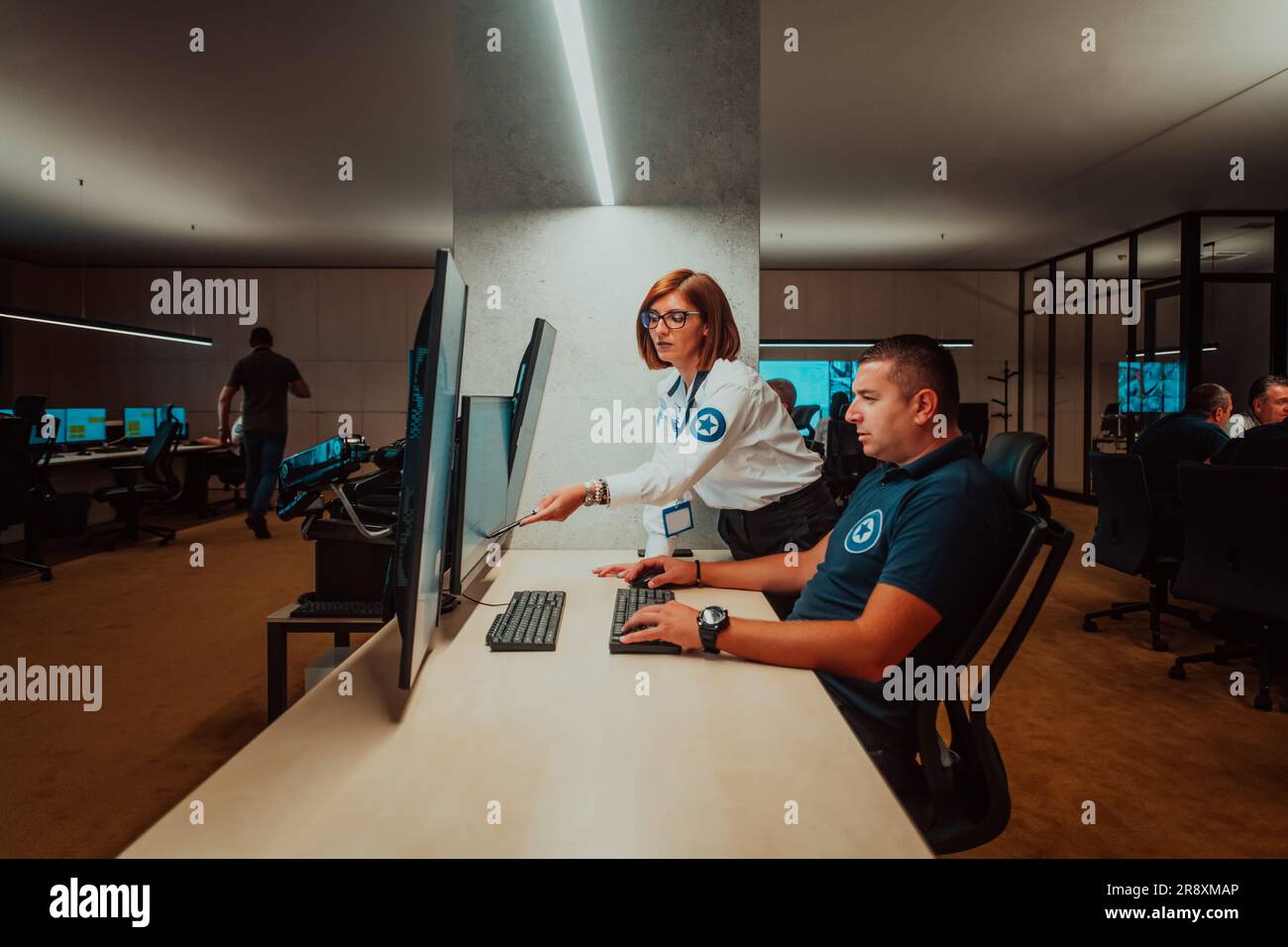 Group of Security data center operators working in a CCTV monitoring ...
