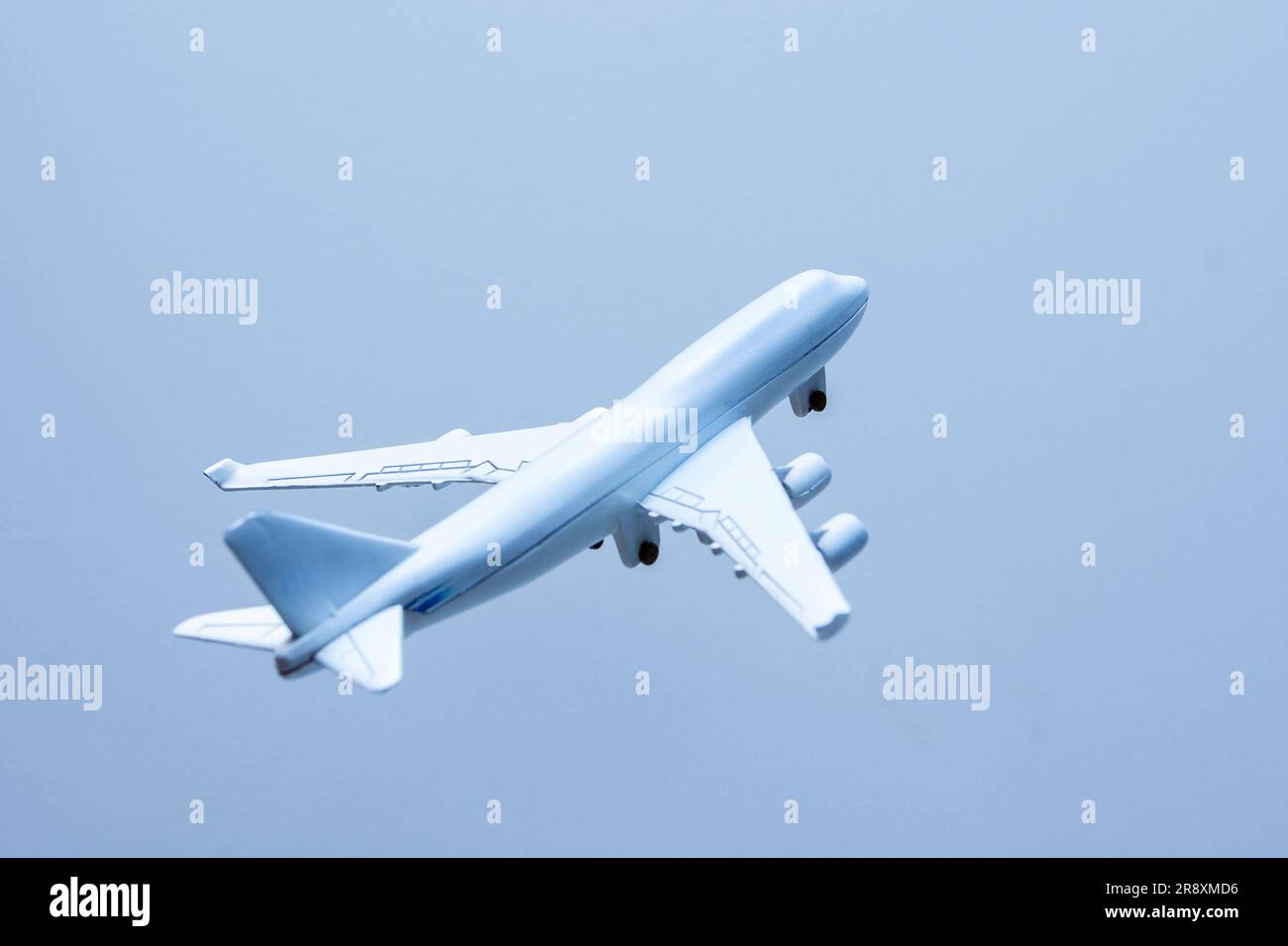 Airplane in the blue sky, closeup of photo with soft focus Stock Photo ...