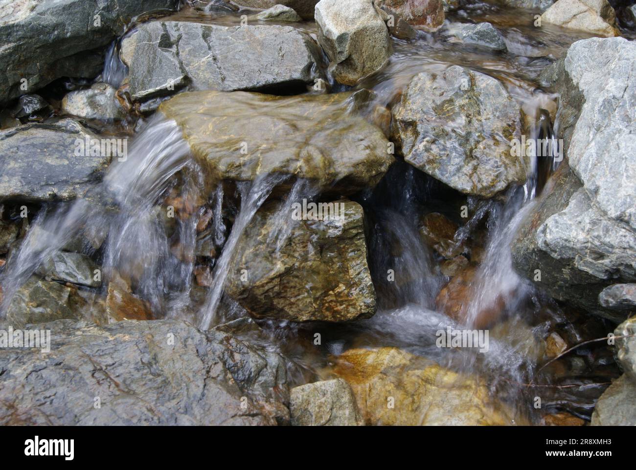 Water flowing over rocks Stock Photo - Alamy