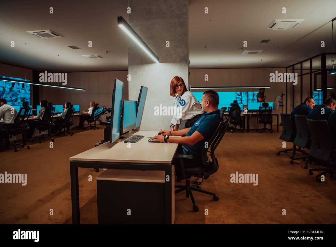 Group of Security data center operators working in a CCTV monitoring ...